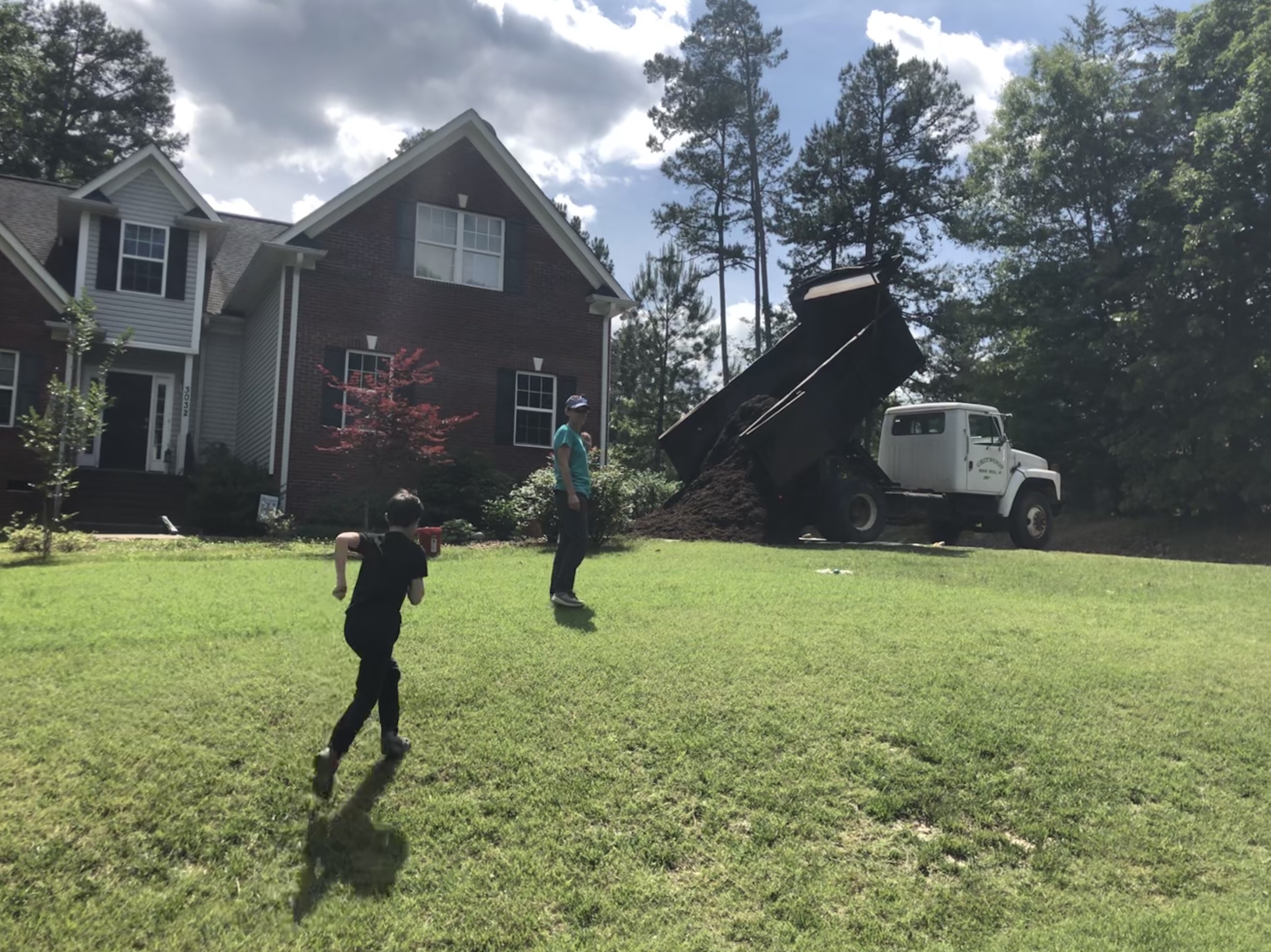 Receiving a load of mulch – BrooksHouse